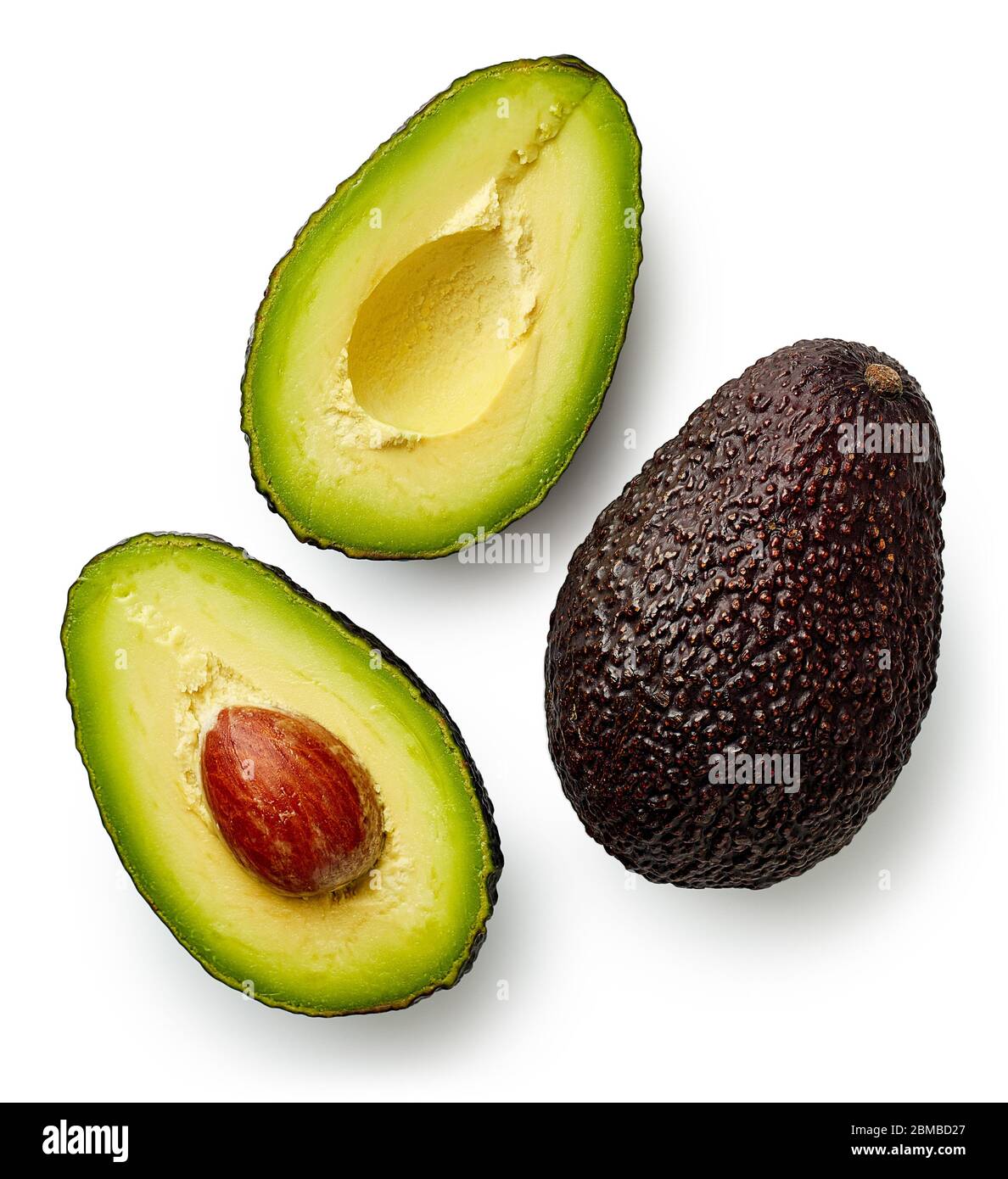 Whole and cut in half avocado isolated on white background. Top view ...