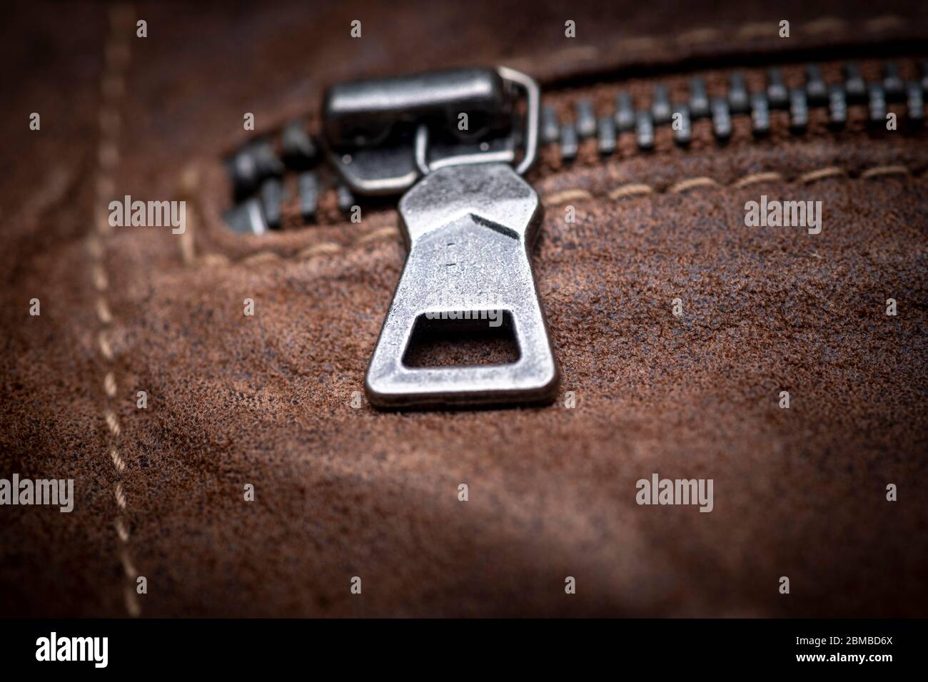 zip fastener on a brown leather motorcycle jacket Stock Photo - Alamy