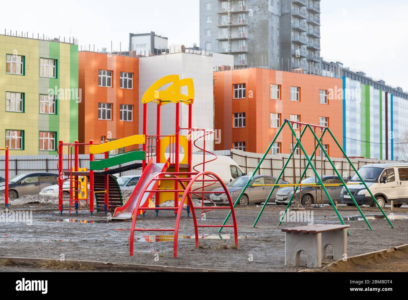 An empty children's playground painted in different colors in the ...