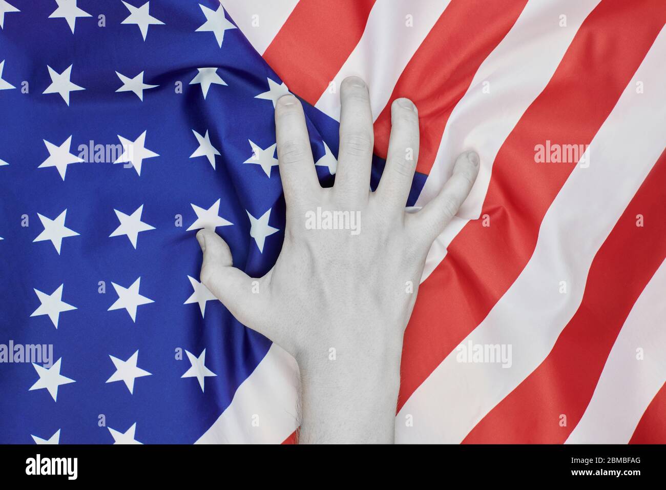 Colorless hand crumpled national USA american flag. Racism and white ...
