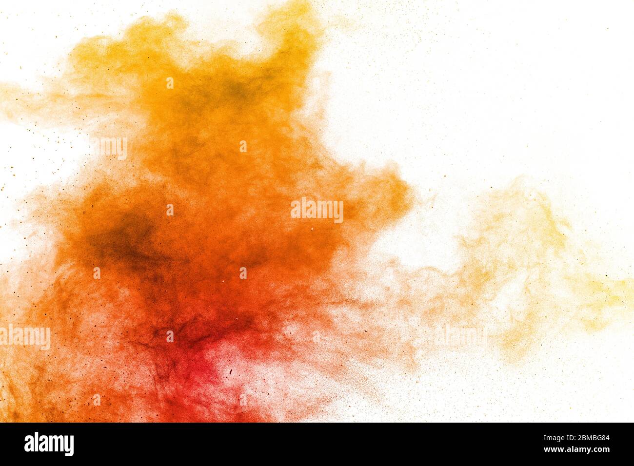 Abstract yellow orange powder explosion on white background.Freeze ...