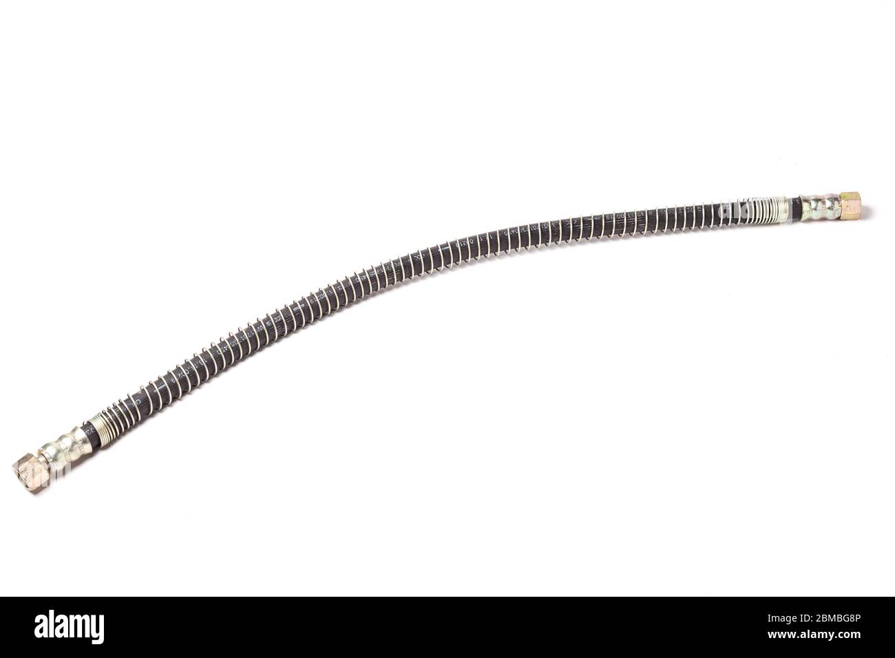 The black brake hose of the truck in a metal spring is a part of the ...