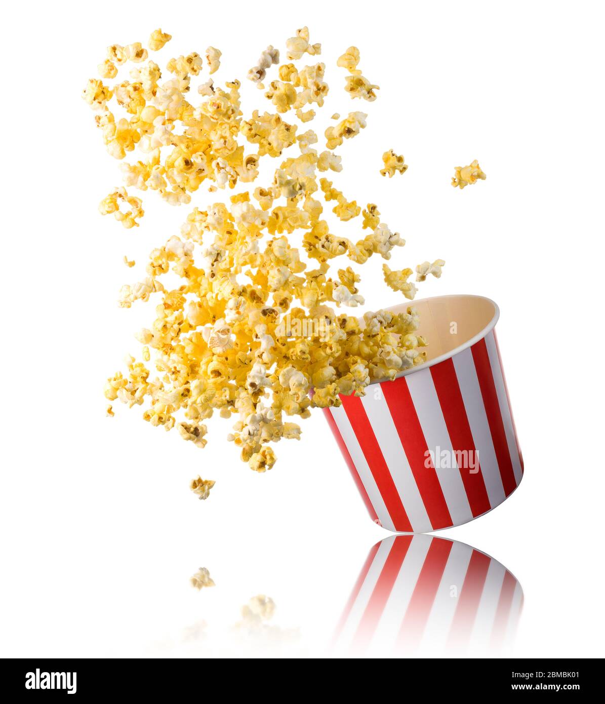 Flying popcorn from paper striped bucket isolated on white background ...