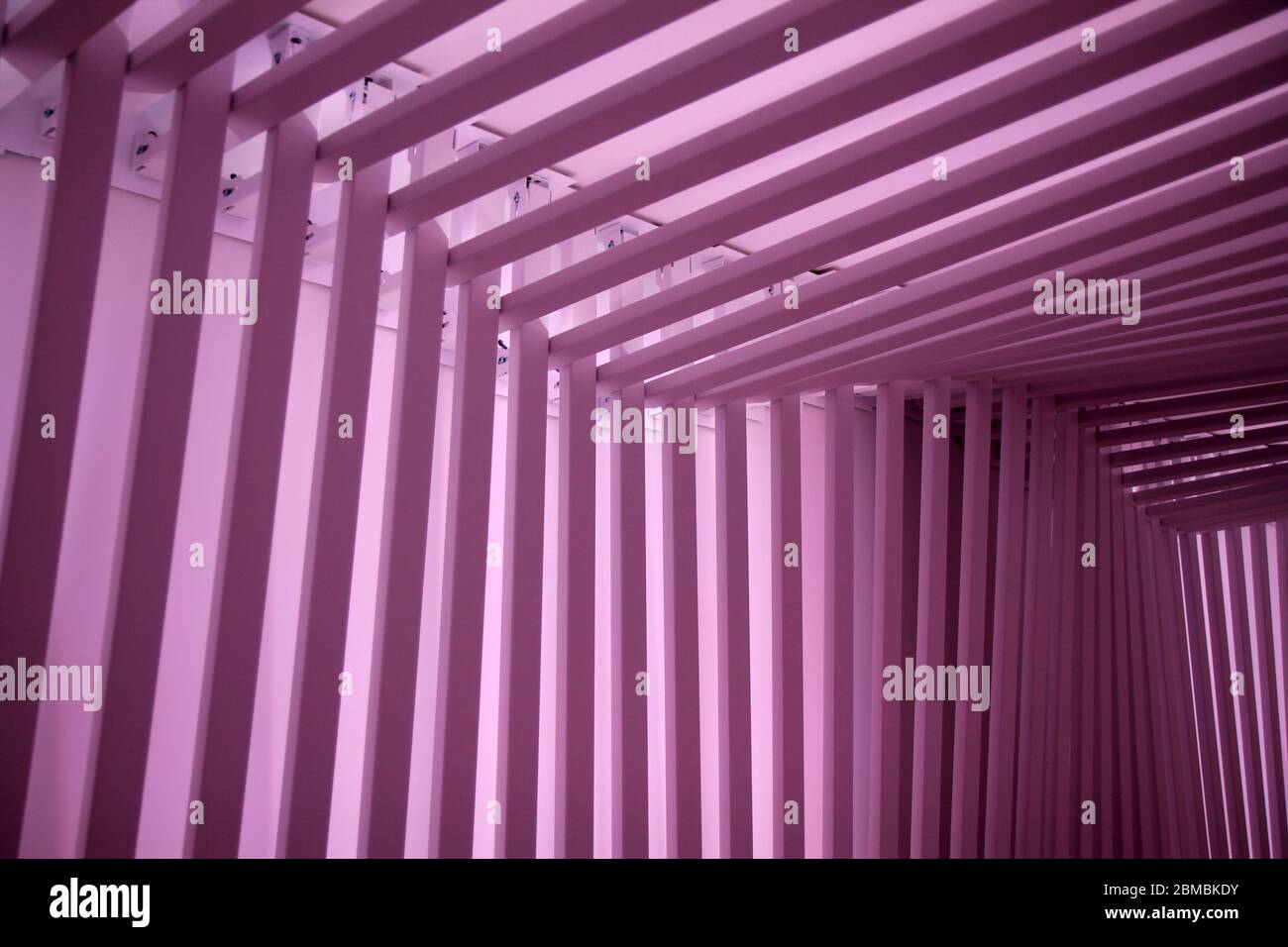 Pink iron artwork with optical illusion Stock Photo - Alamy