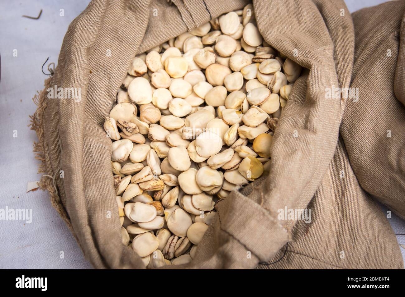 Beans in sack legumes. Beans grains on a rustic cloth bag. Agriculture ...