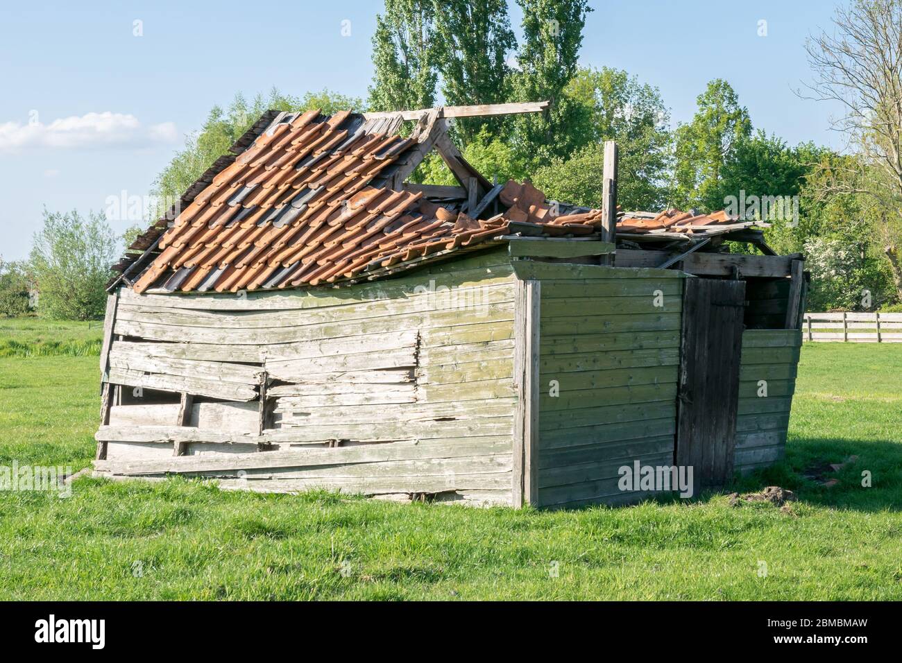 Wooden barn in the Dutch countryside in decay Stock Photo - Alamy