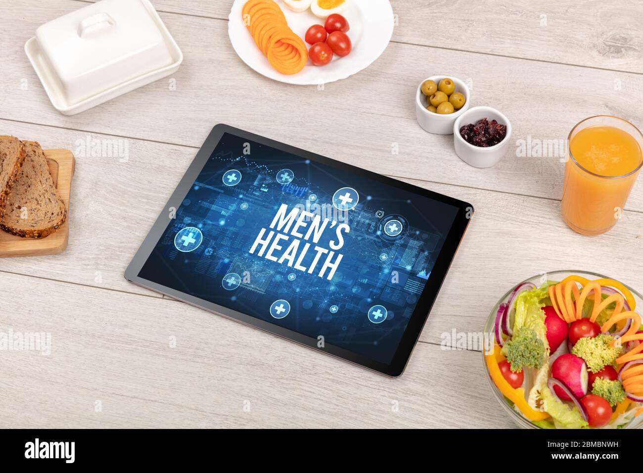 MEN’S HEALTH concept in tablet pc with healthy food around, top view ...