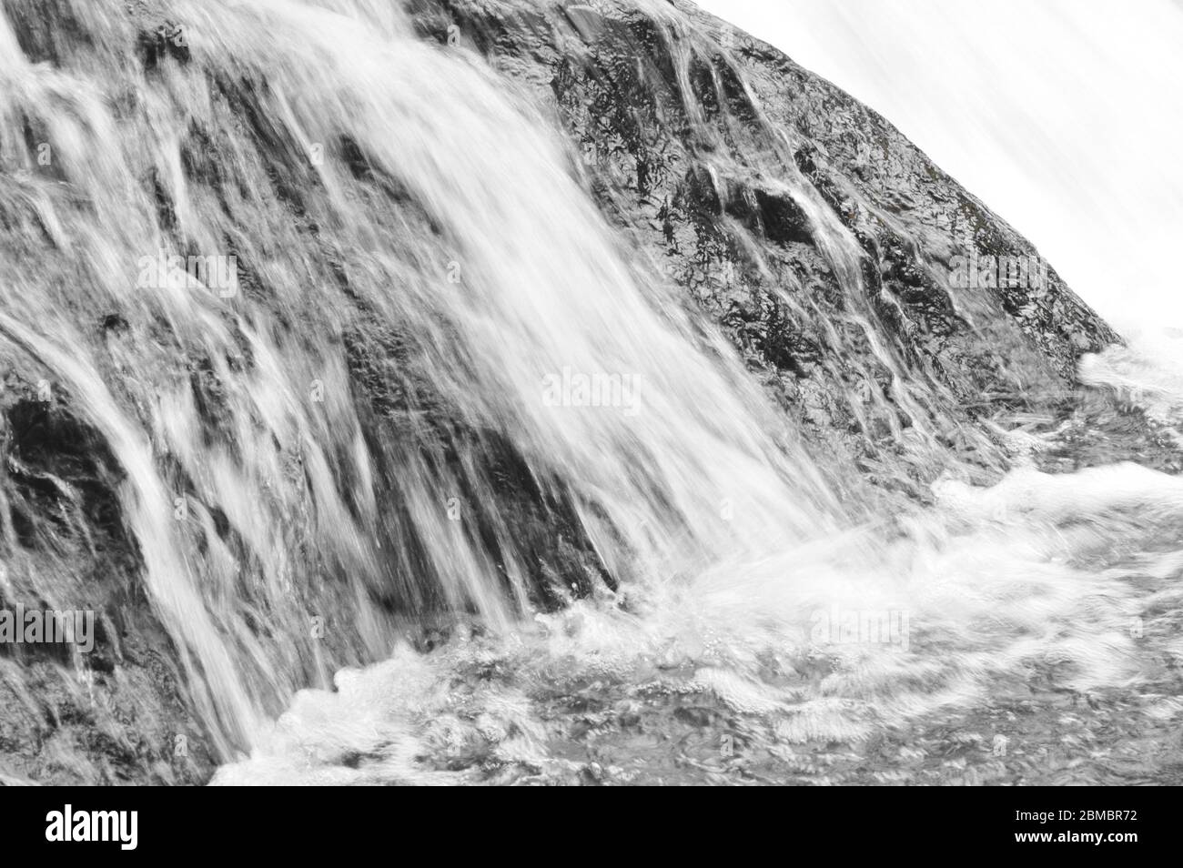 waterfall falling and hit rock splashing to river Stock Photo - Alamy
