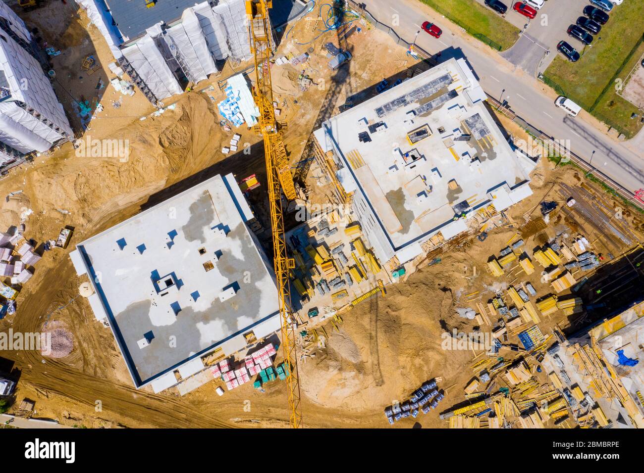 Construction site with cranes. Construction workers are building ...