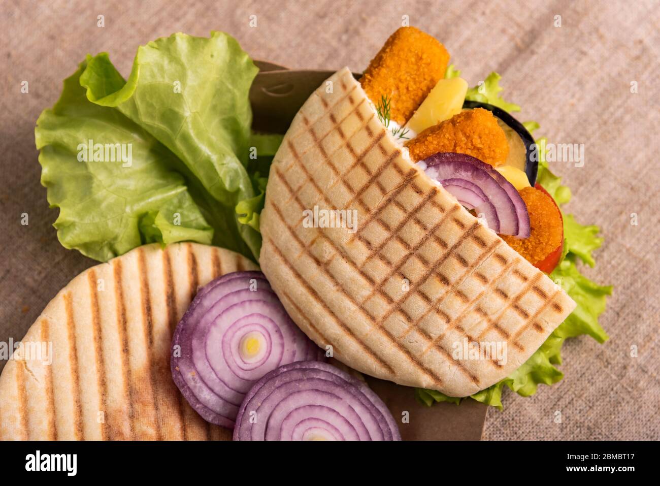 Pita doner kebab with green salad, tomatoes cherry, potato free ...