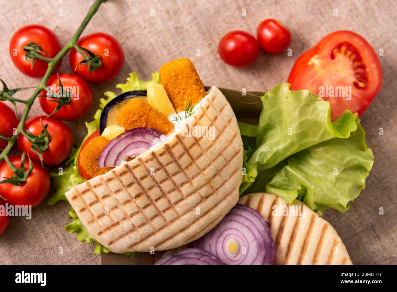 Pita doner kebab with green salad, tomatoes cherry, potato free ...