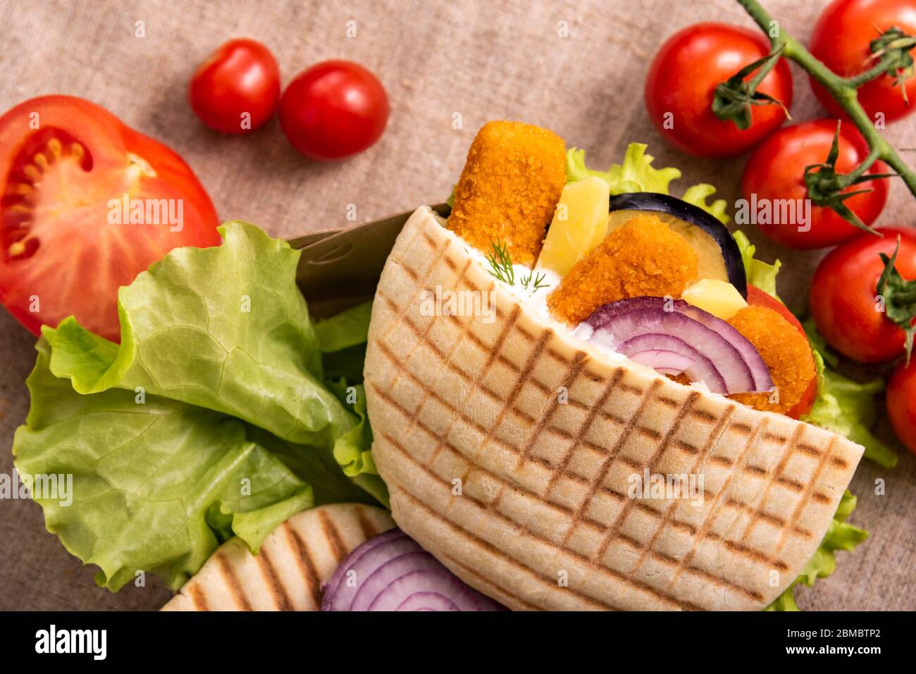 Pita doner kebab with green salad, tomatoes cherry, potato free ...