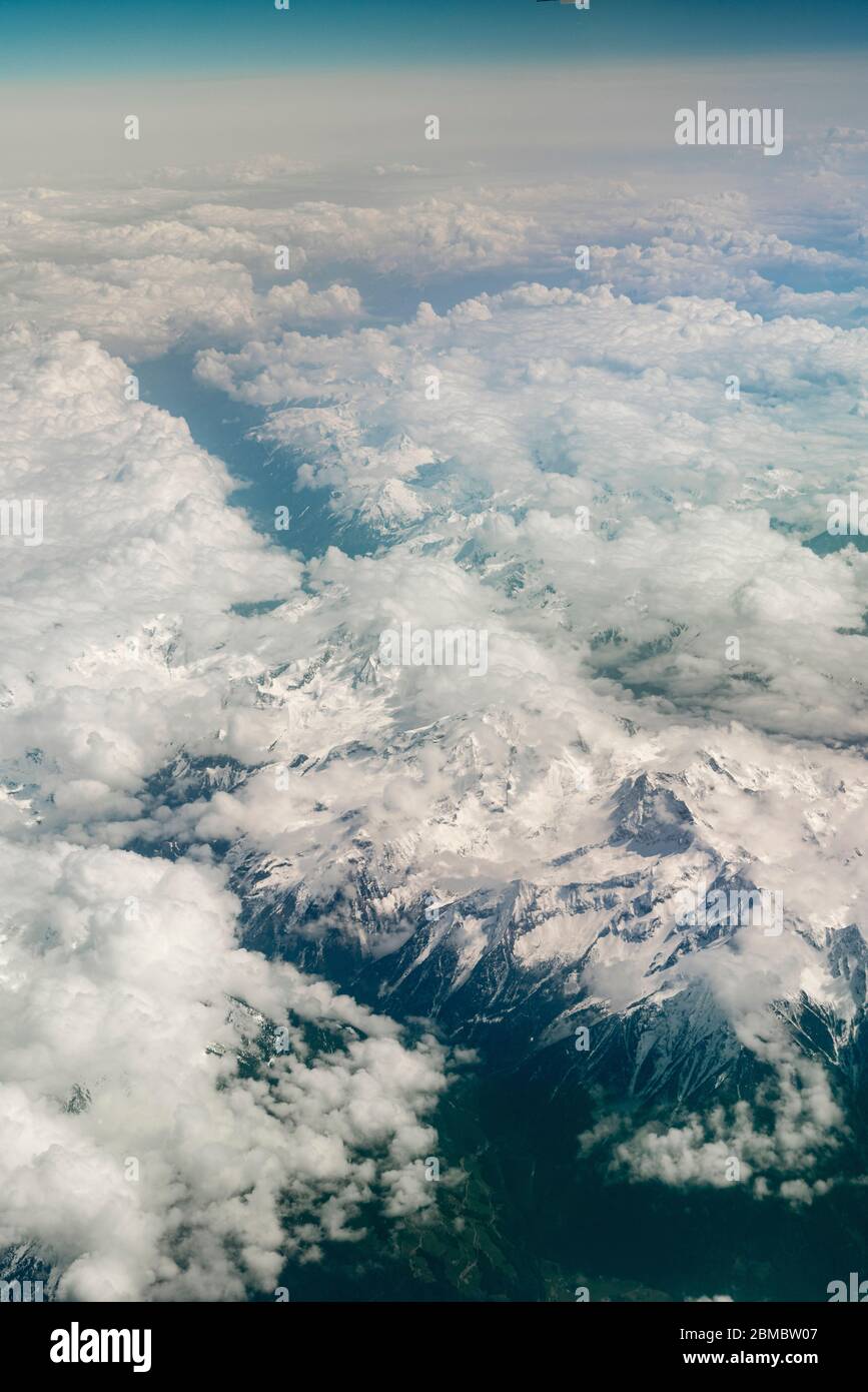 Aerial of the alps from airplane covered with snow Stock Photo - Alamy