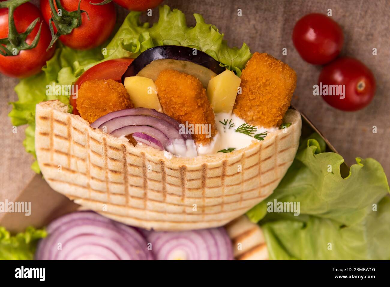 Pita doner kebab with green salad, tomatoes cherry, potato free ...