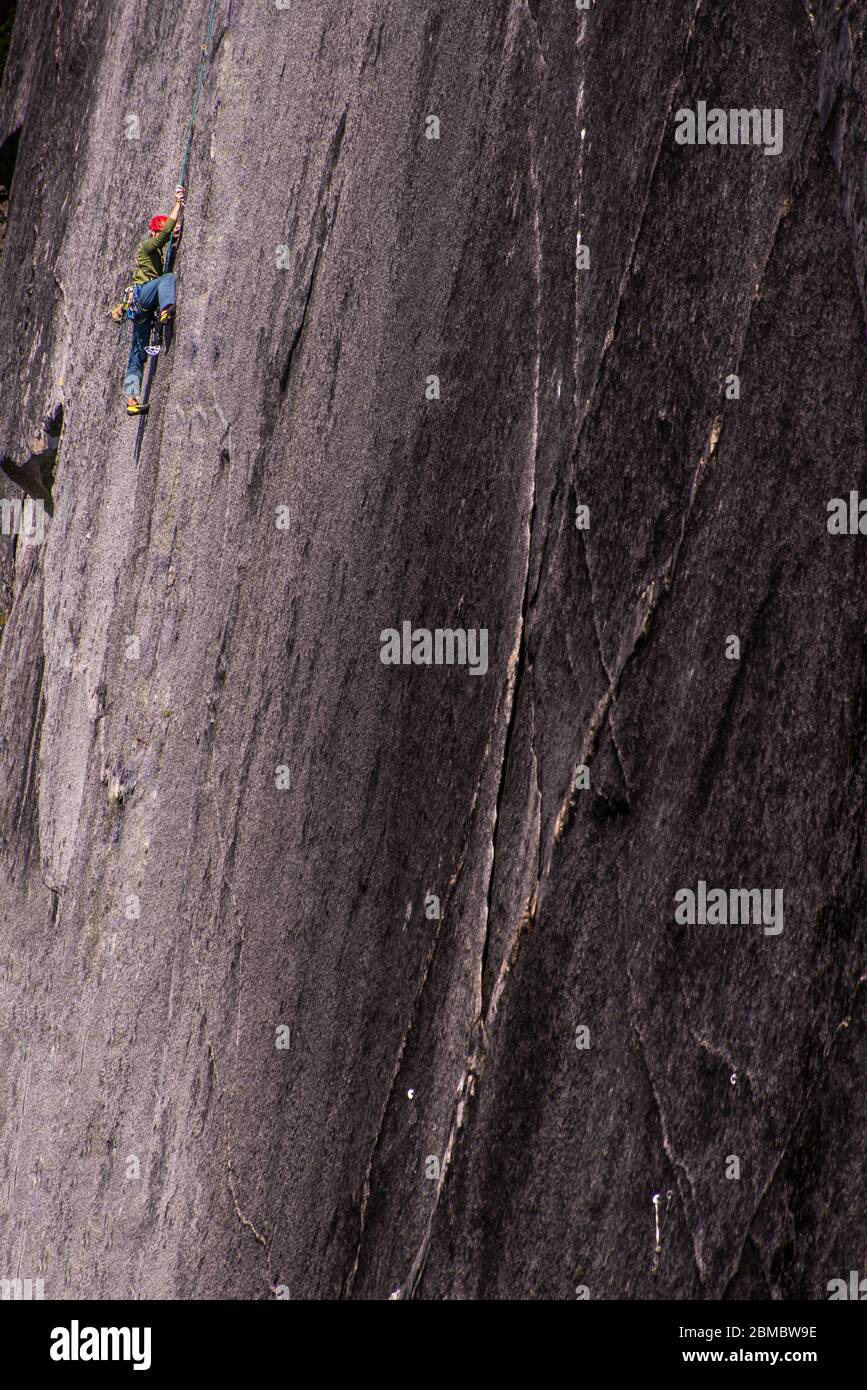 Man rock climbing big granite blank rock face in Squamish Chief BC ...