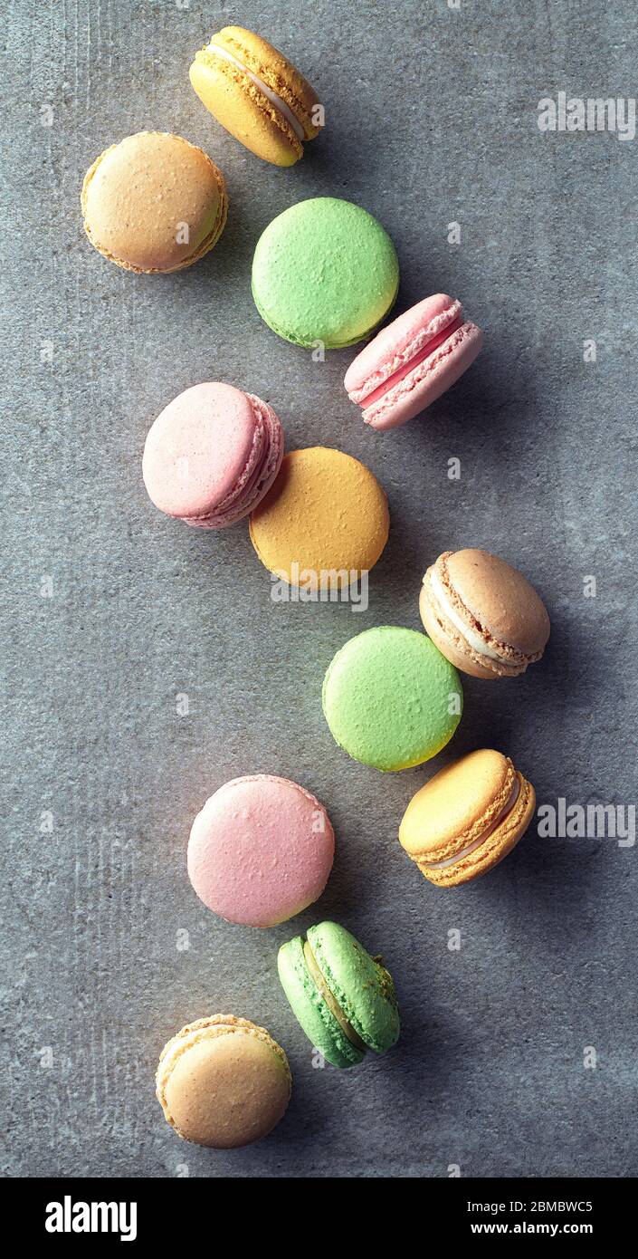Colorful macarons on gray marble background. Top view. Pastel colors ...