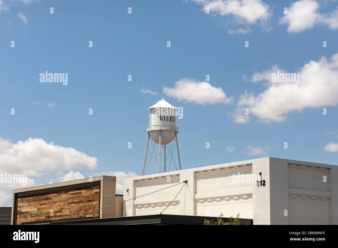 Gilbert water tower rising above buildings in foreground daytime Stock ...