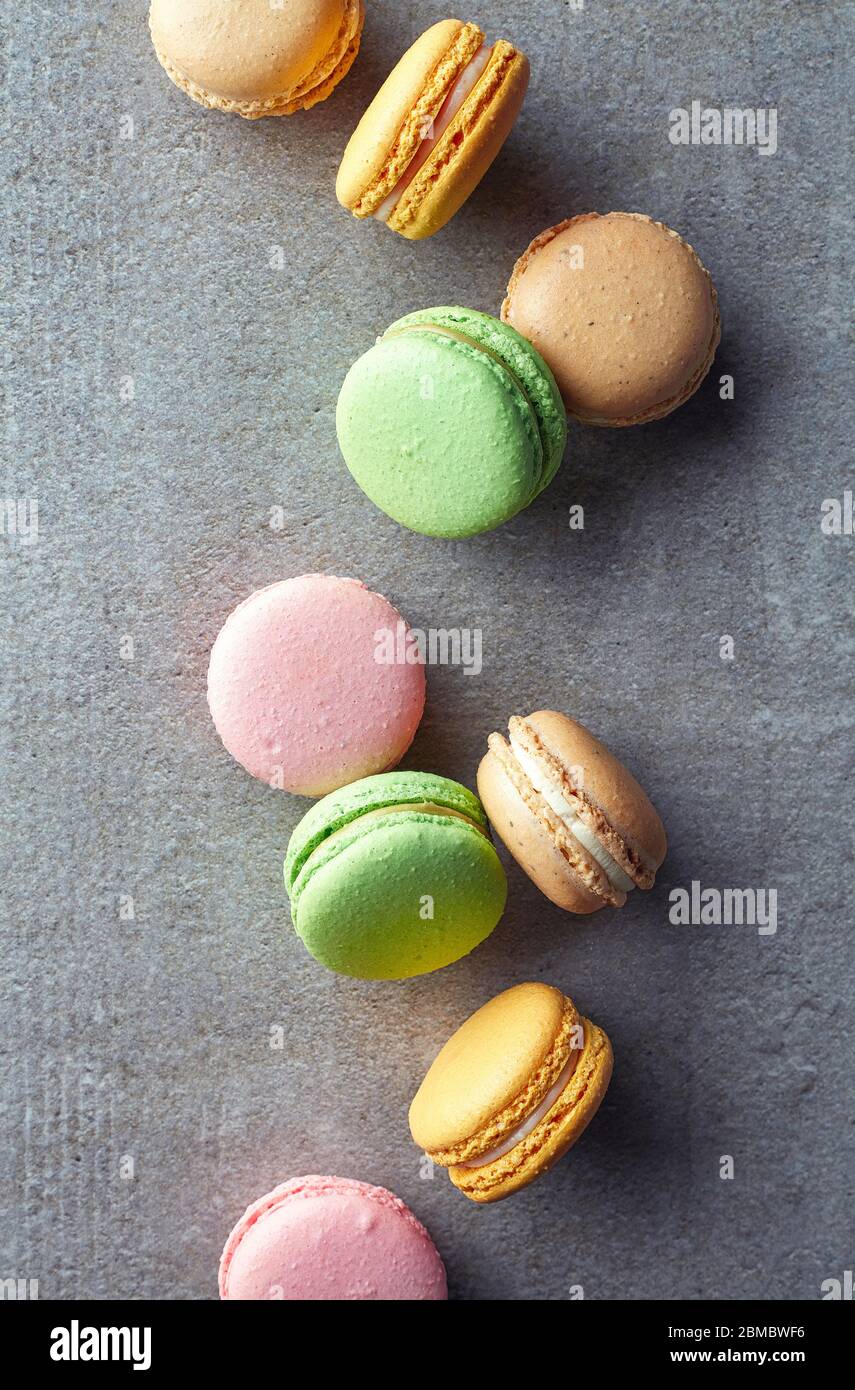 Colorful macarons on gray marble background. Top view. Pastel colors ...