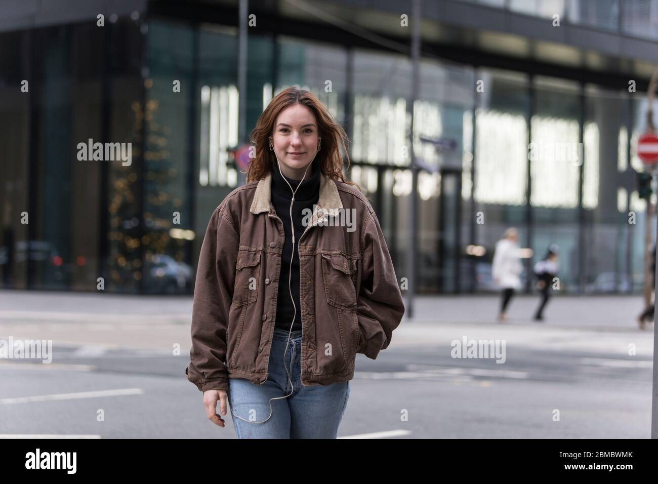 Medium shot young model walking hi-res stock photography and images - Alamy