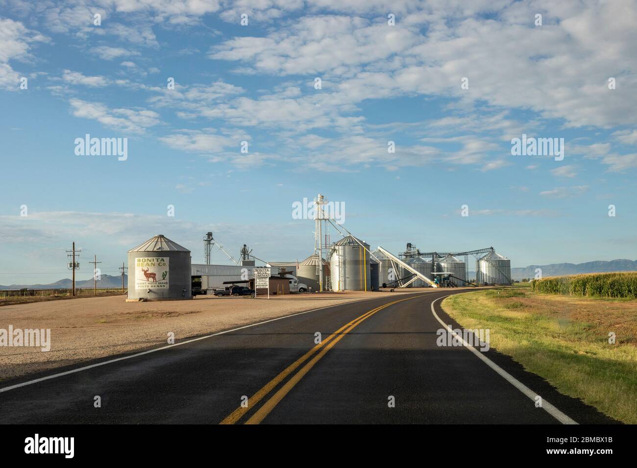 Grain silos on a roadside farm as seen from drivers perspective Stock ...