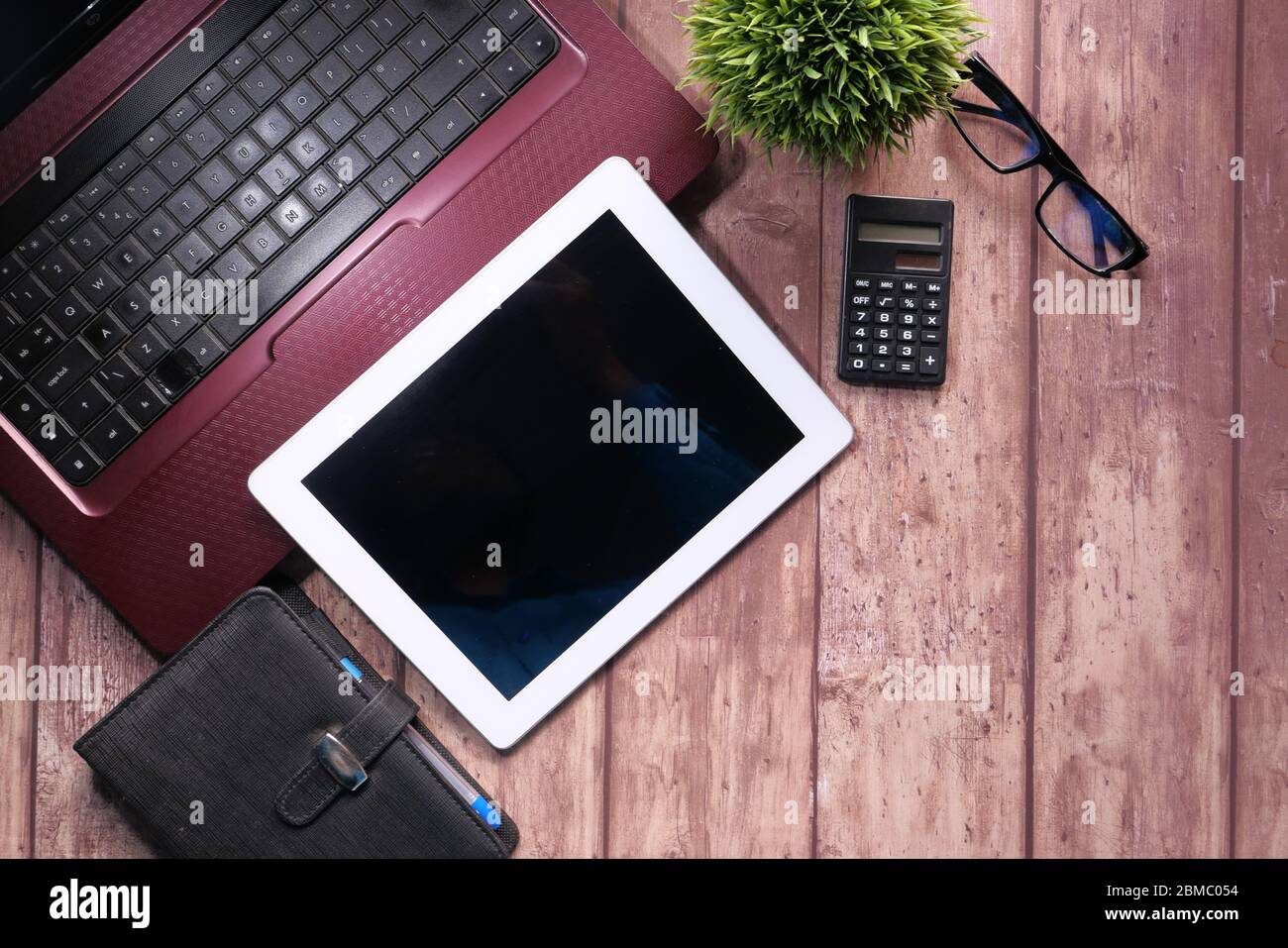 Top view of digital tablet, laptop and notepad on table Stock Photo - Alamy