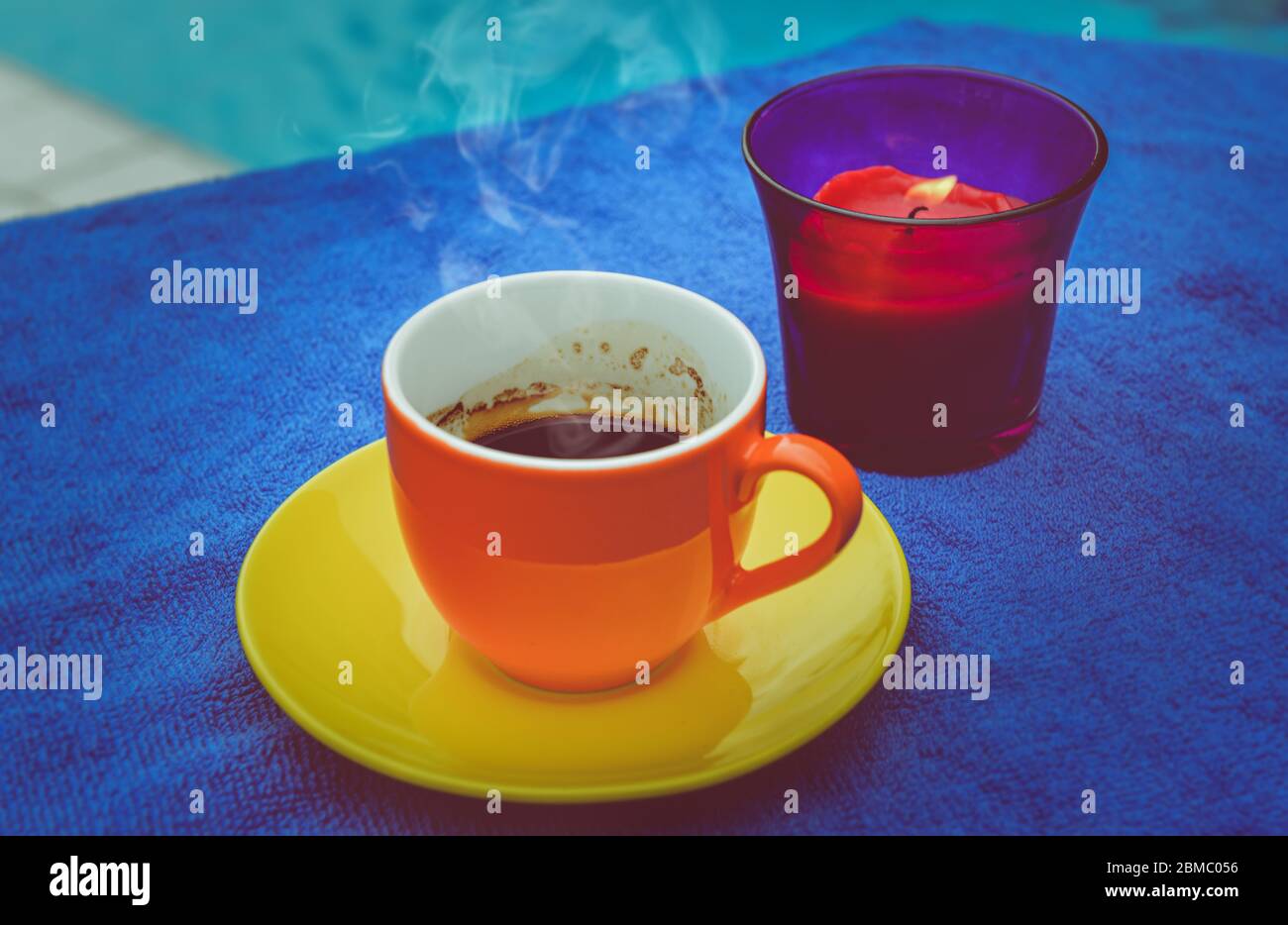 Hot espresso coffee serve on hotel swimming pool relax table with ...