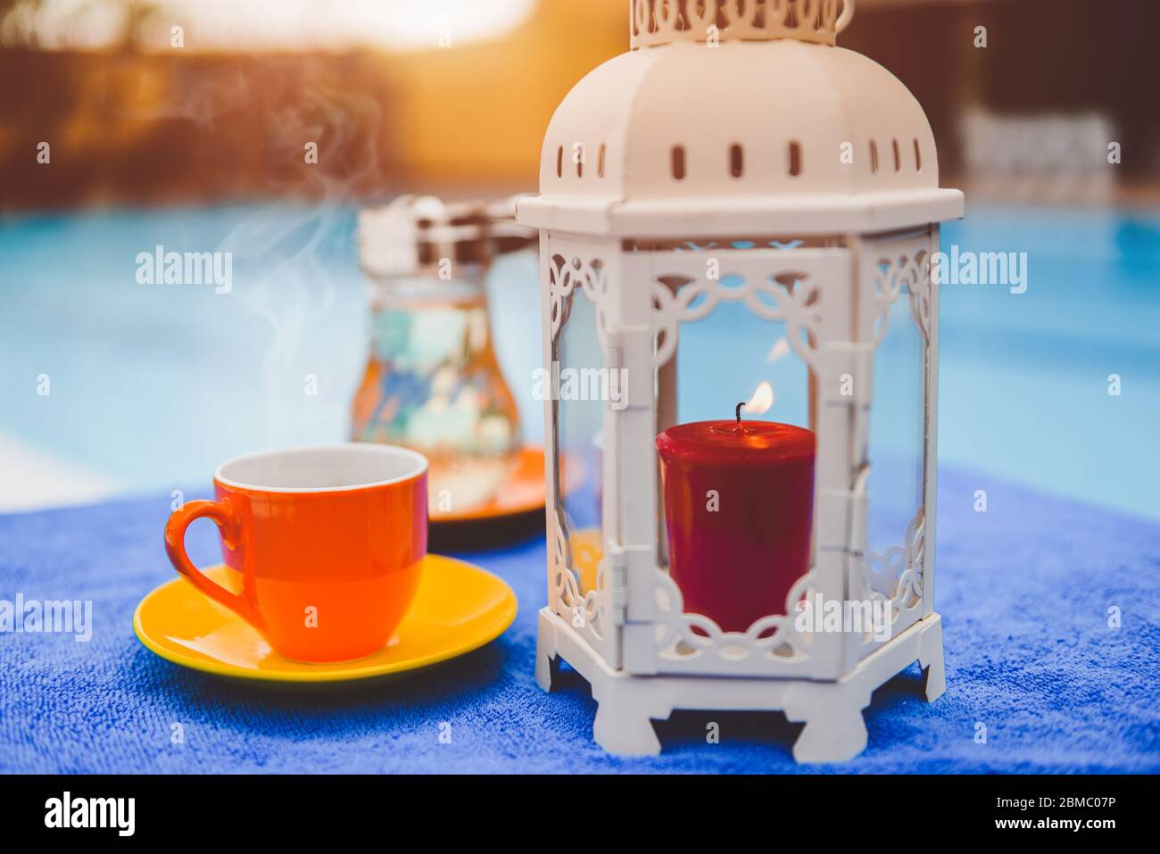 Hot espresso coffee serve on hotel swimming pool relax table with ...