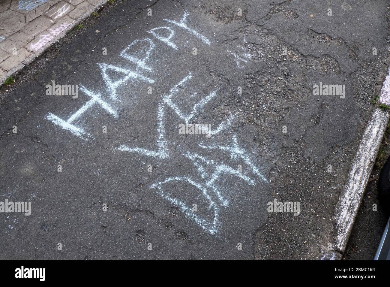 A Happy VE Day message written in chalk on a pavement in Bugbrooke ...