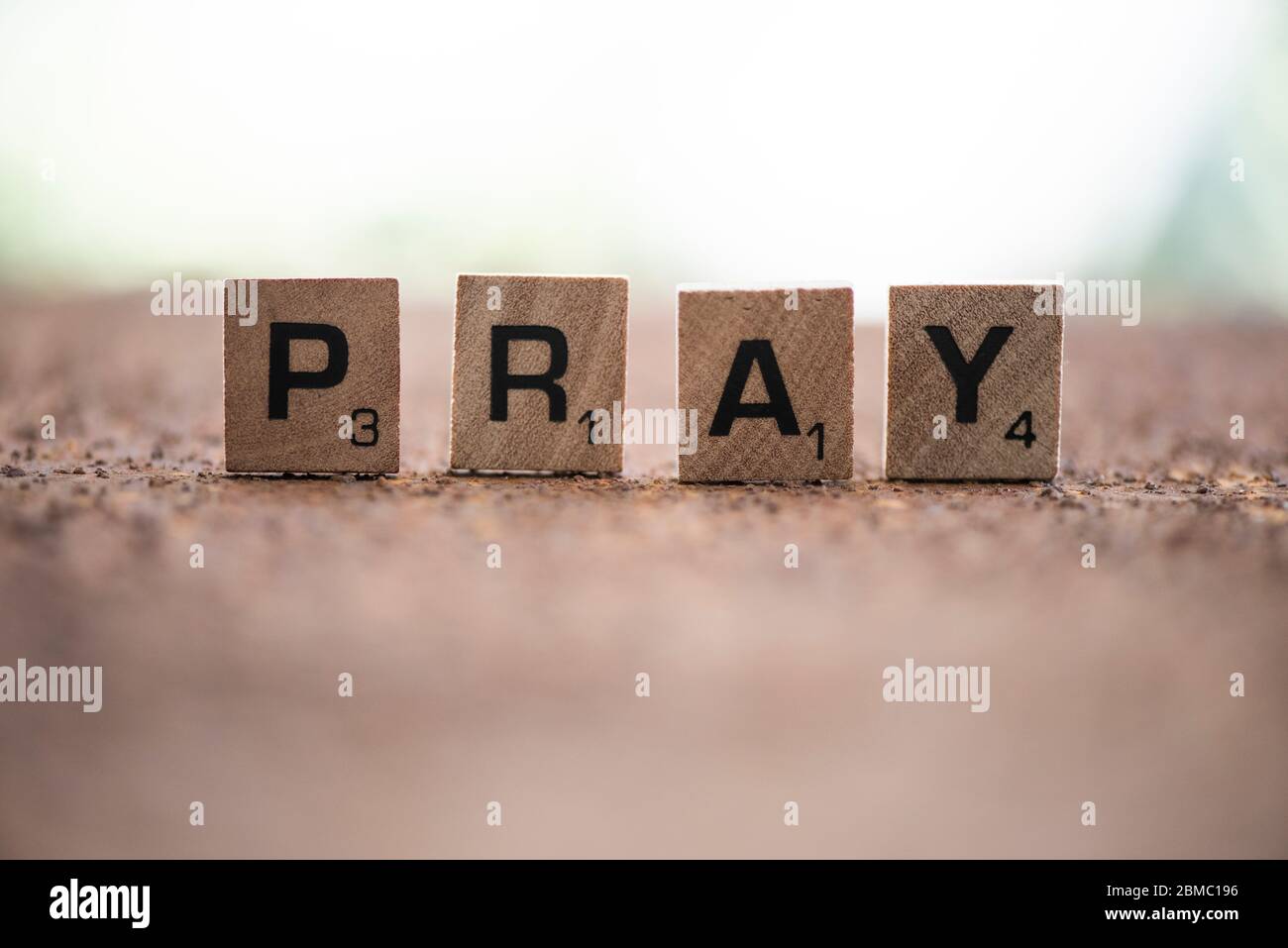Pray in block letters Stock Photo - Alamy