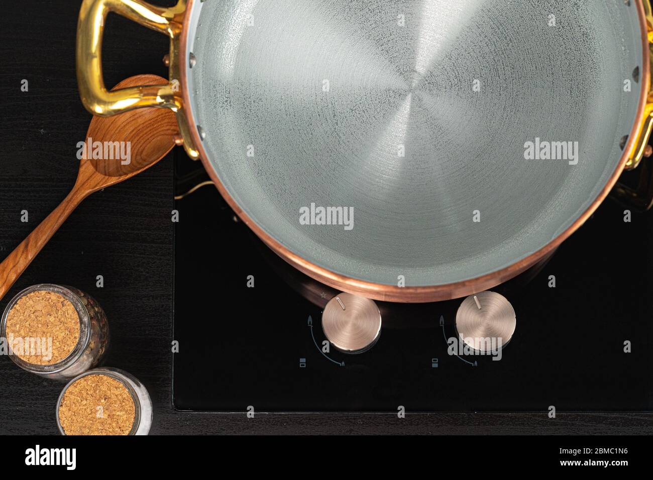 Copper pot with boiling water on a gas stove Stock Photo - Alamy