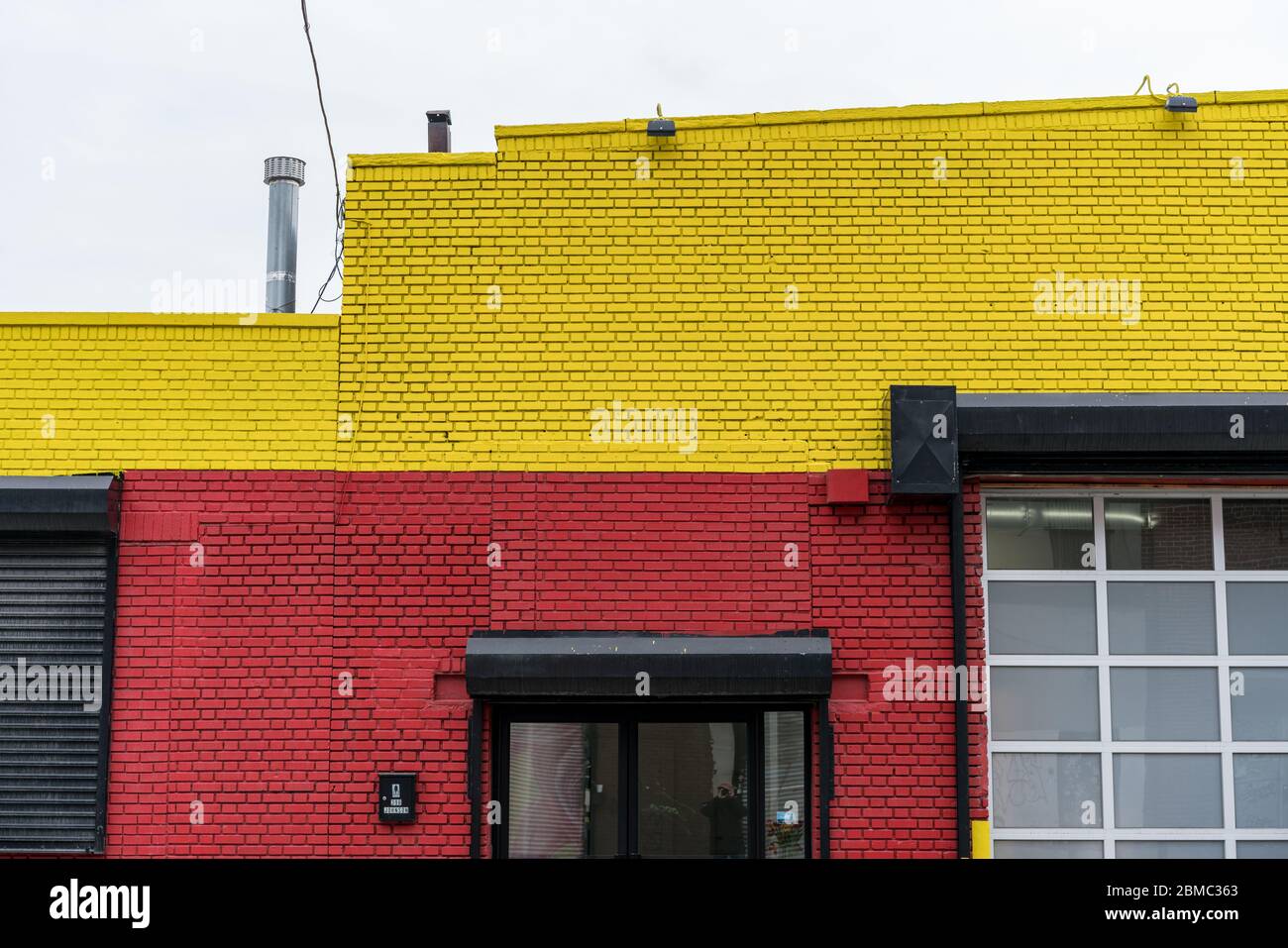 Yellow, black, and red warehouse Stock Photo - Alamy