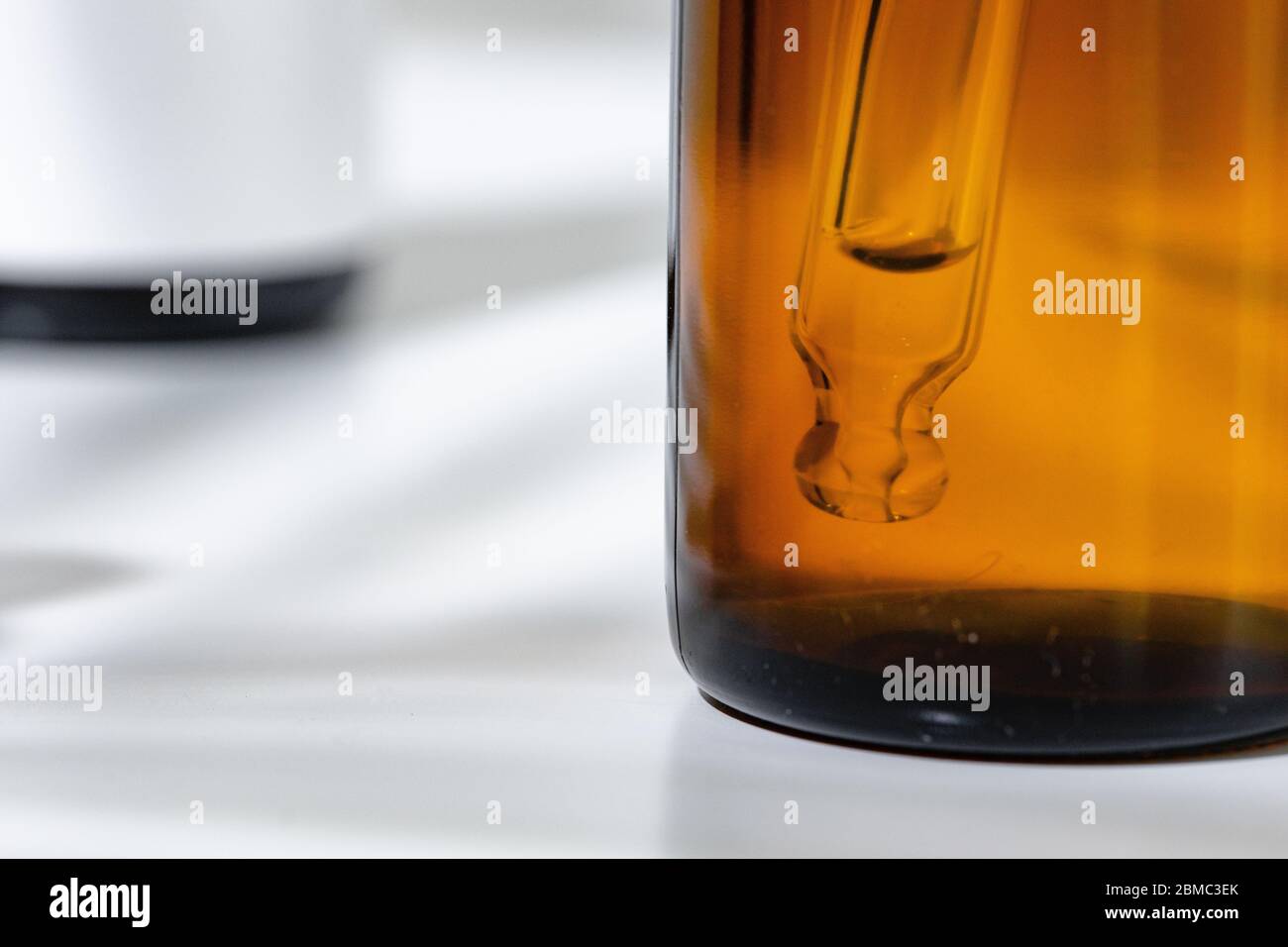 Close up photo of glass cosmetics container for oily texture Stock ...