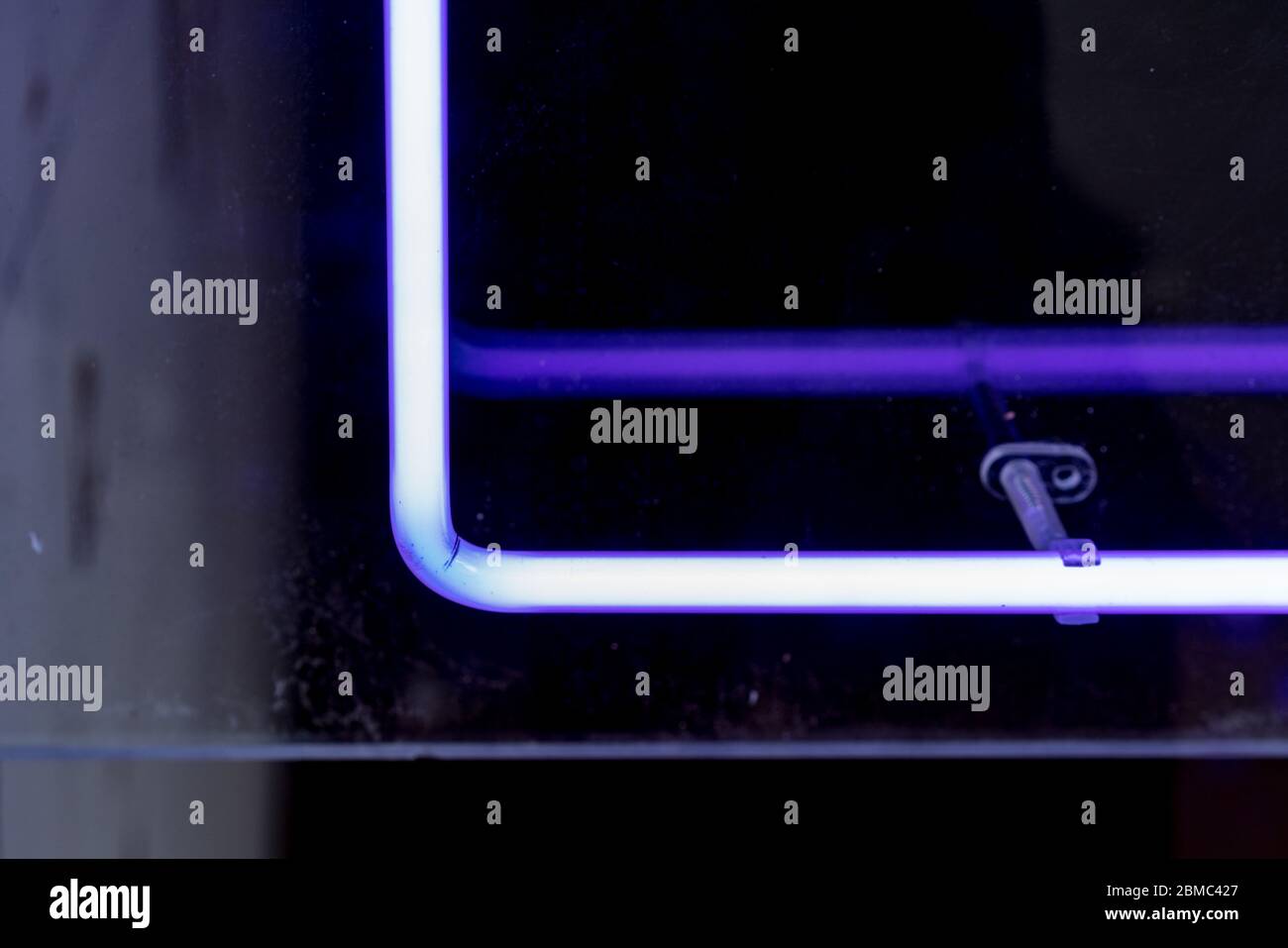 Purple neon sign Stock Photo - Alamy