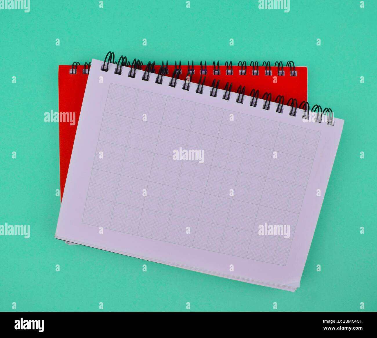 Two different color note paper diary placed on top of each other on a ...