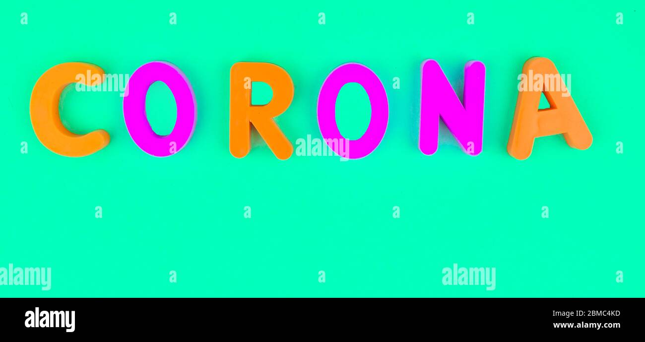 Corona word written with different colored letter blocks on a blue ...