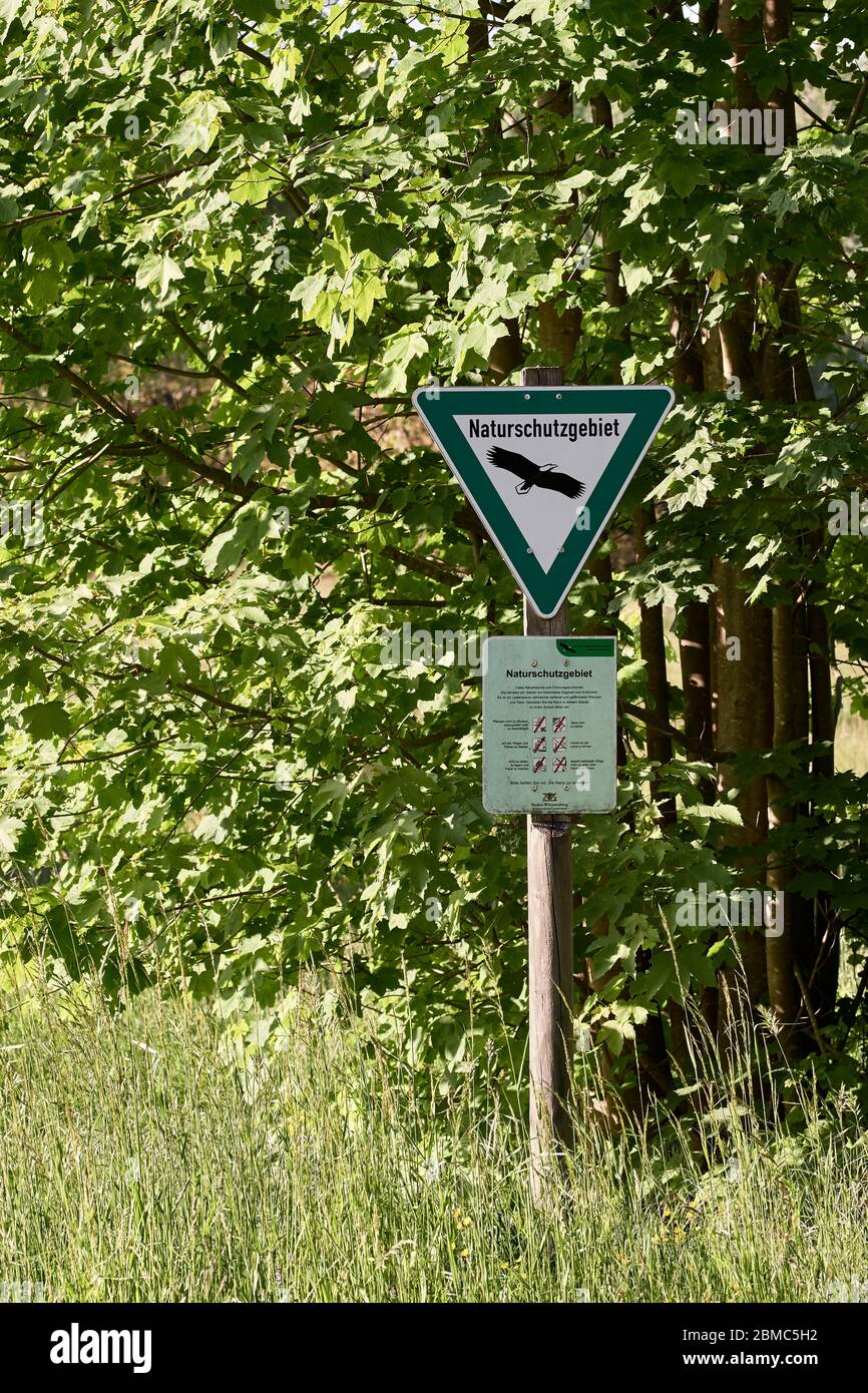 Green triangular sign with an eagle and behavior rules for a German ...