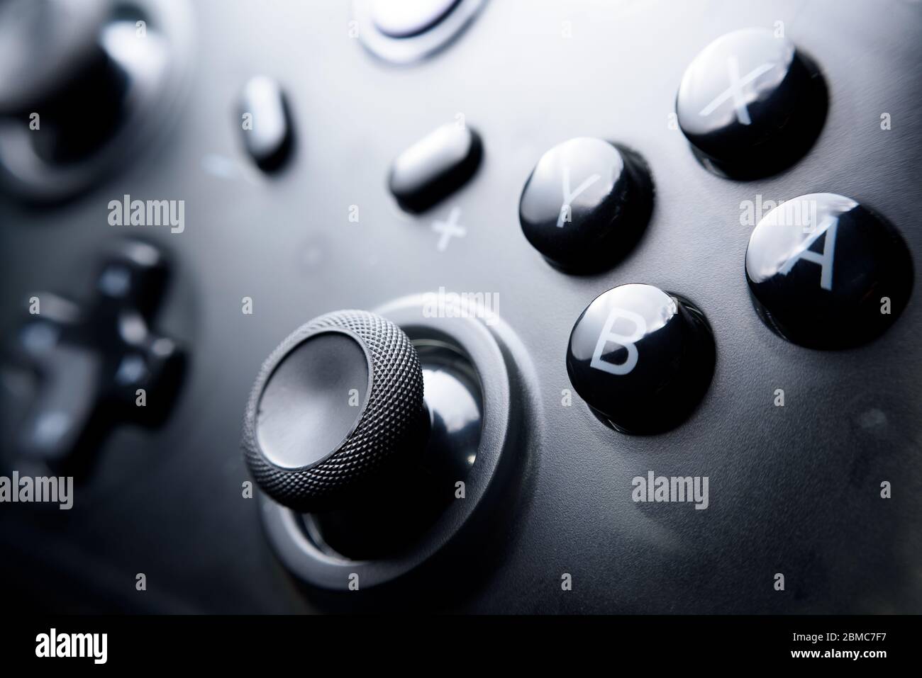 Black modern controller with black buttons Stock Photo - Alamy