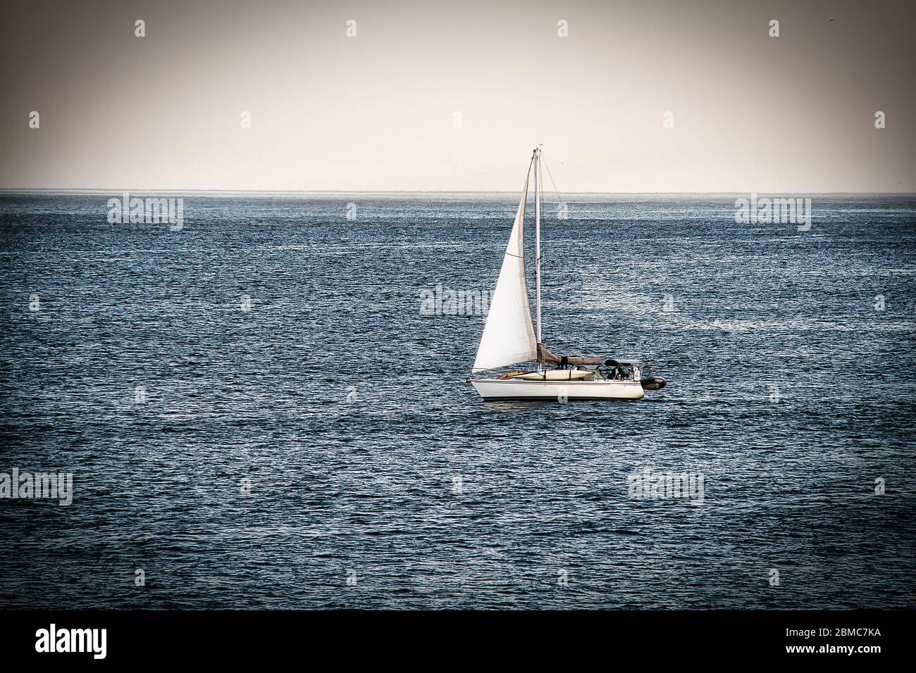 Sailboat on the Open Ocean Stock Photo - Alamy