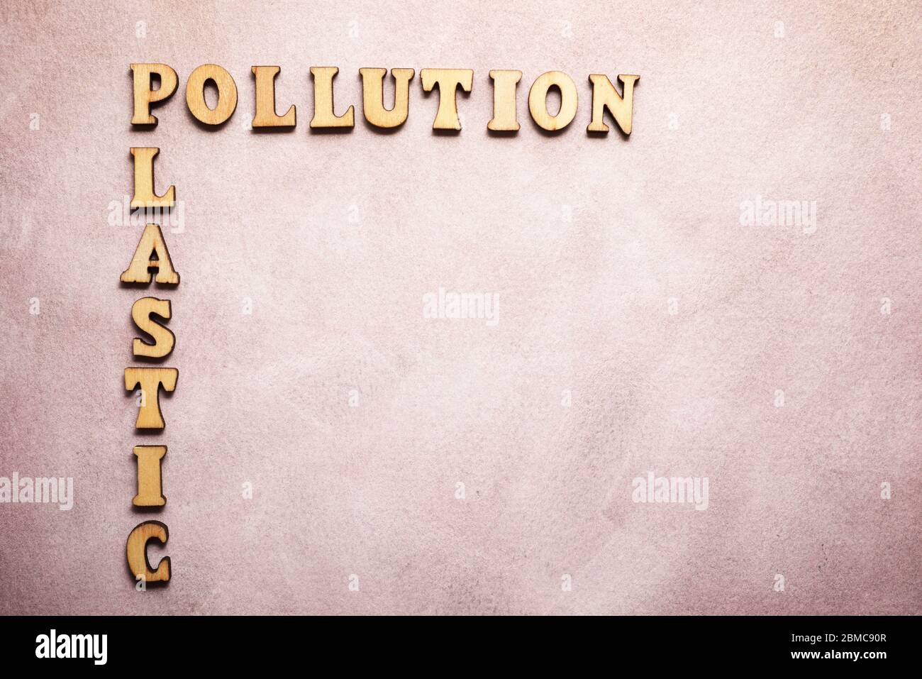 Plastic pollution text on a colored paper Stock Photo - Alamy