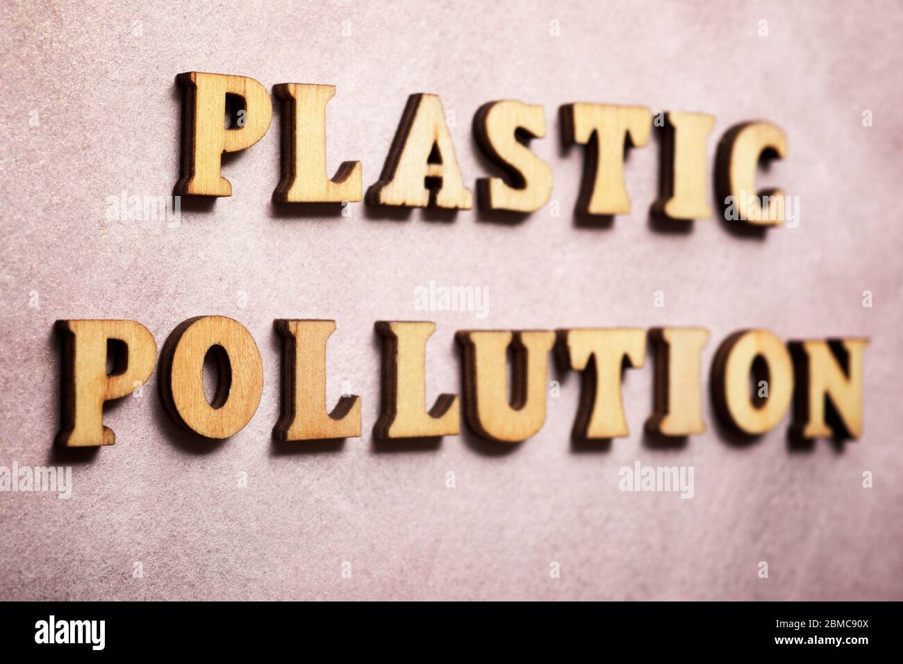 Plastic pollution text on a colored paper Stock Photo - Alamy