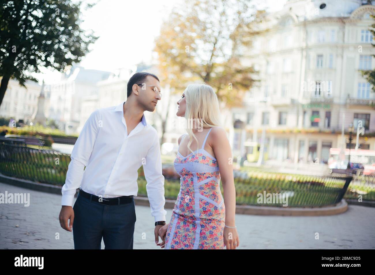 Romantic tourist couple walking around the city relaxing Stock Photo ...