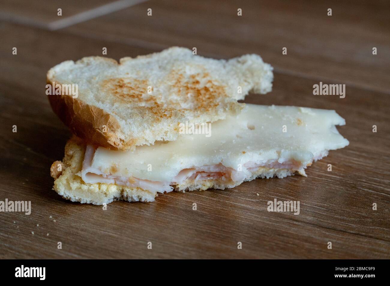 Bread tossed to the floor. Thrown into the trash food. Half Eaten ...