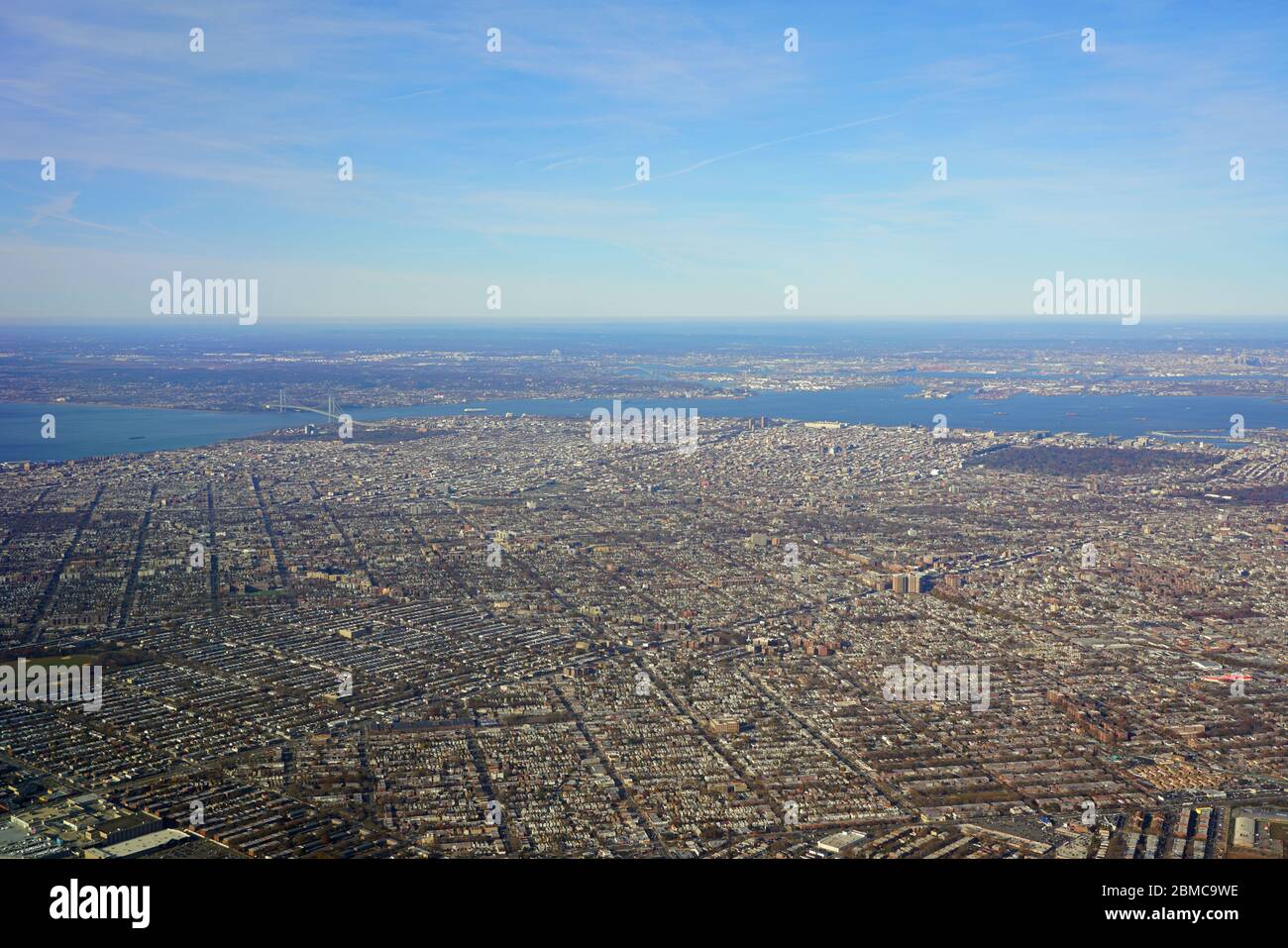 Aerial view of Queens, the Verrazzano Narrows Bridge and New York City ...