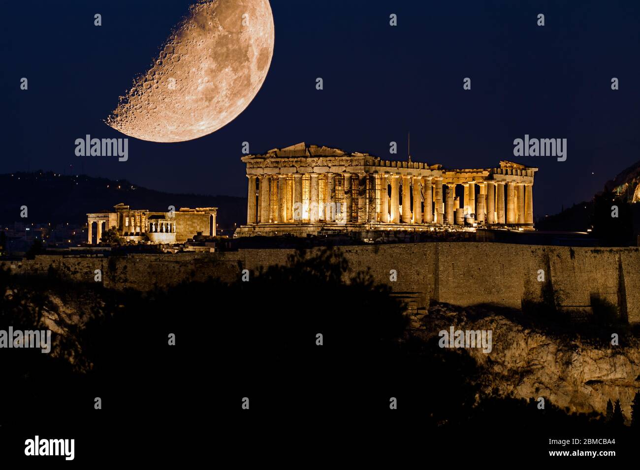 Parthenon of Athens under a huge magnificent moon, at dusk time, Greece Stock Photo - Alamy