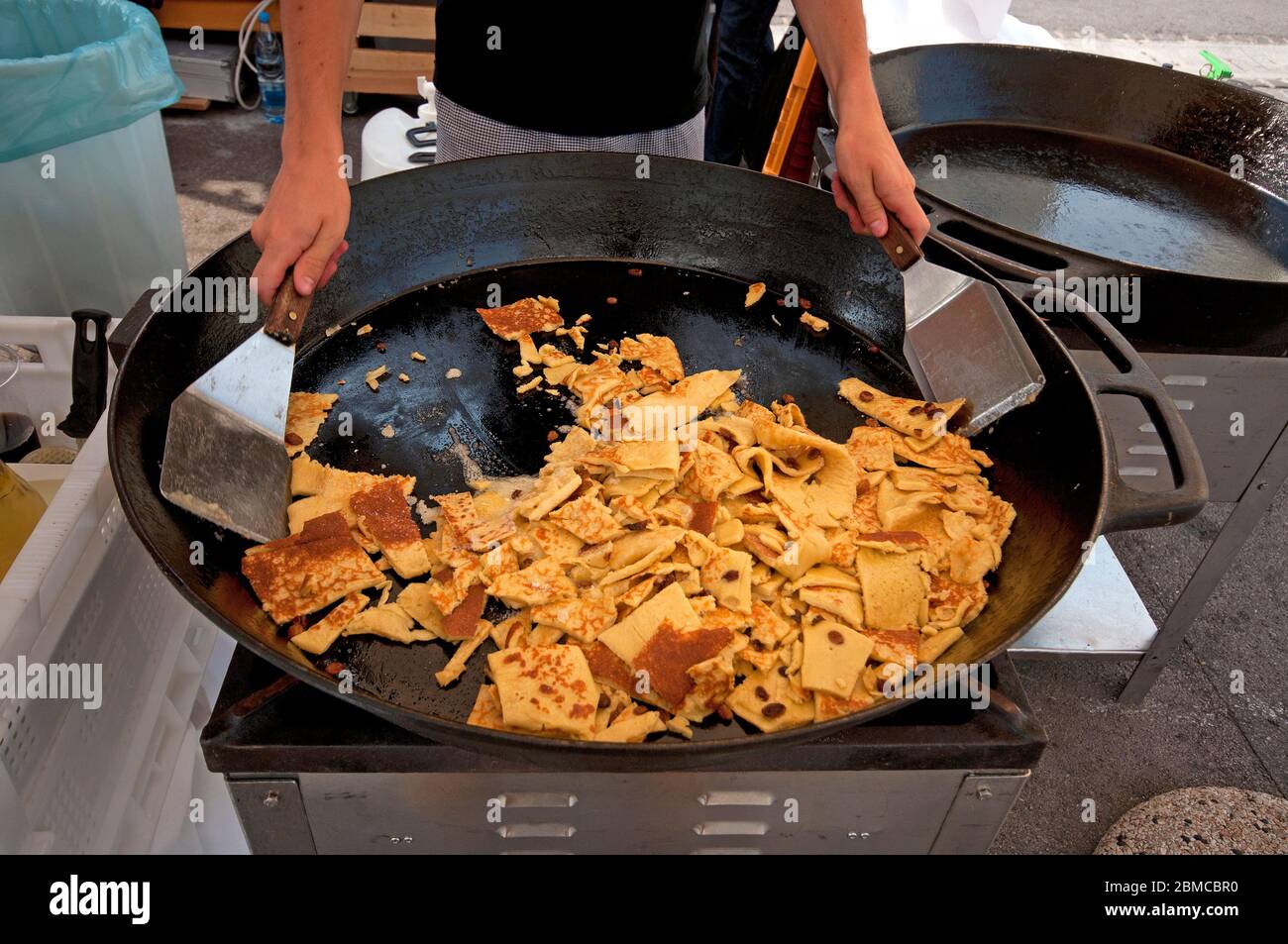 Cooking typical food for sale at open kitchen in central market ...