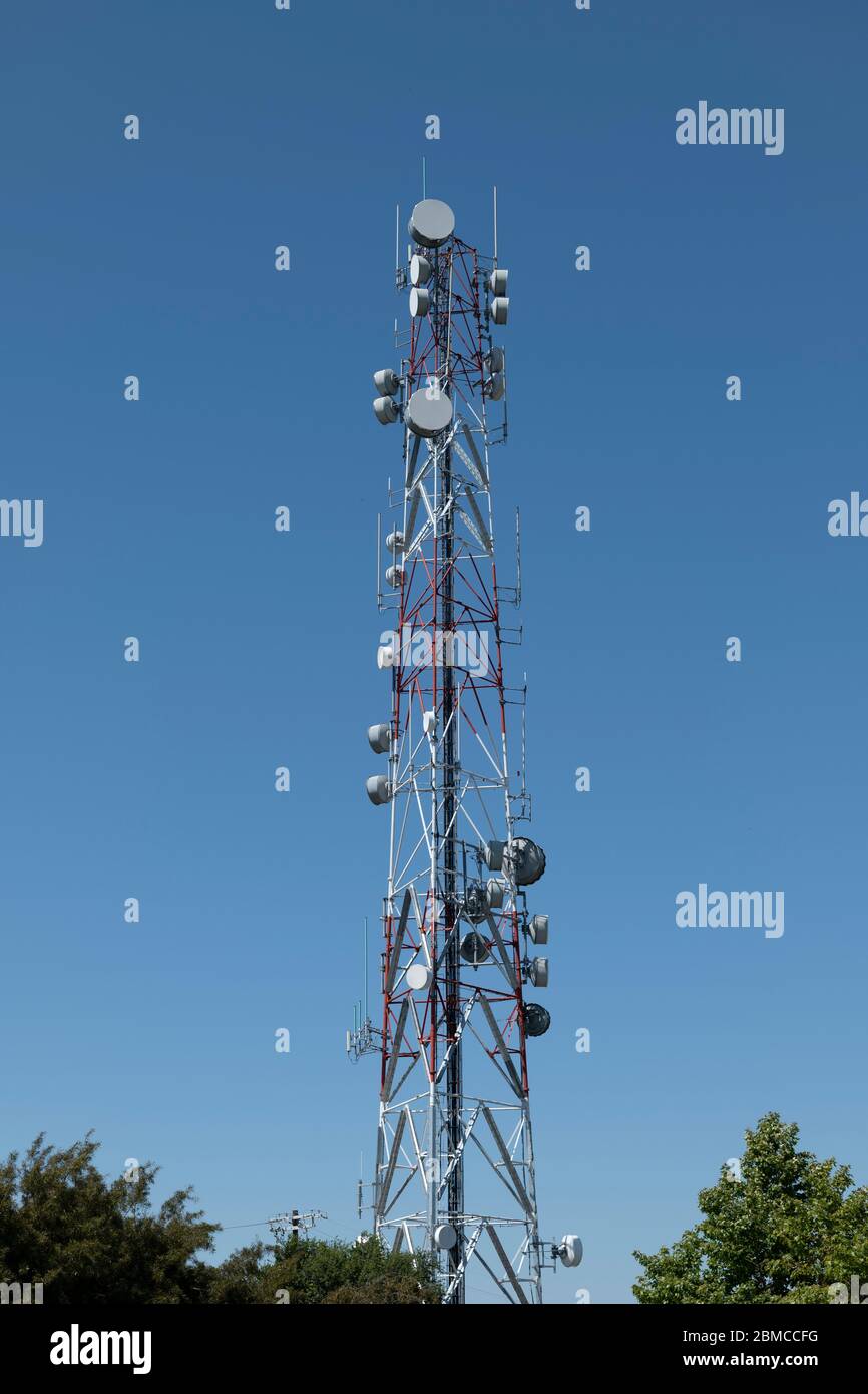 A large communications tower for mulitple signal types Stock Photo - Alamy