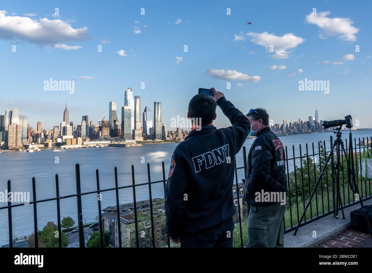 NEW YORK, NEW YORK - MAY 07, 2020: People watch as JetBlue honors ...