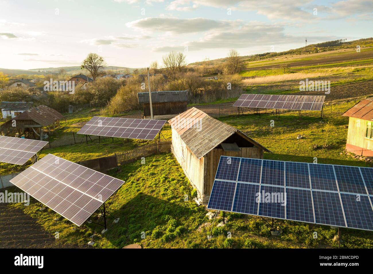 Aerial top down view of solar panels in green rural village yard Stock ...