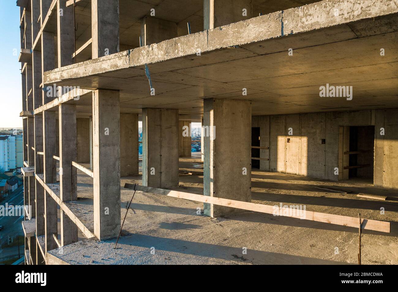 Aerial view of concrete frame of tall apartment building under ...