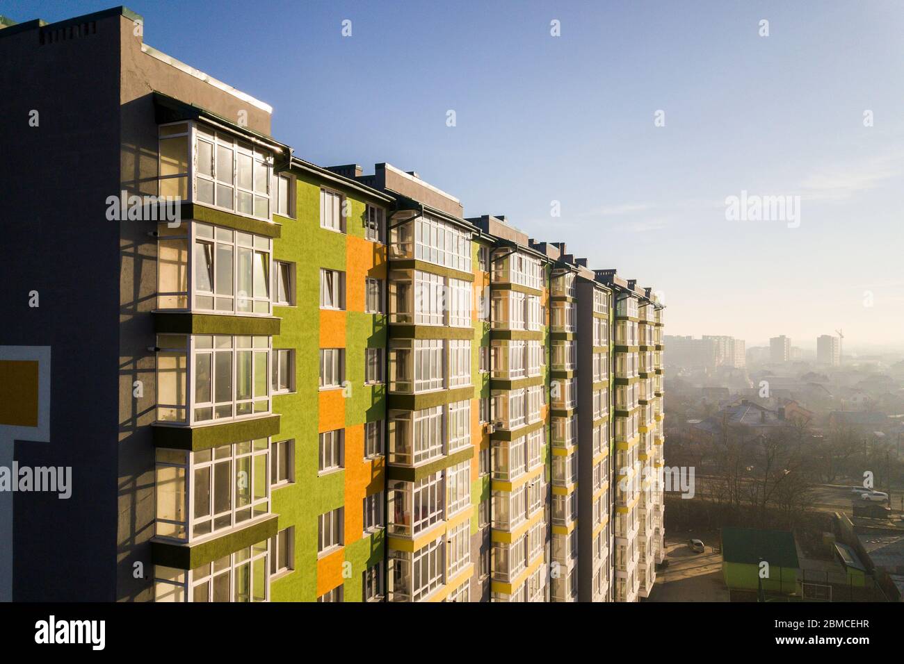 Aerial view of a tall residential apartment building with many windows ...